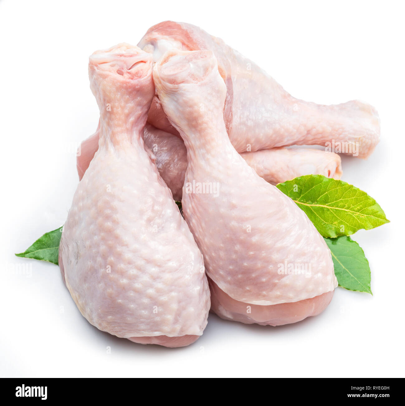 Raw chicken legs isolated on white background Stock Photo - Alamy