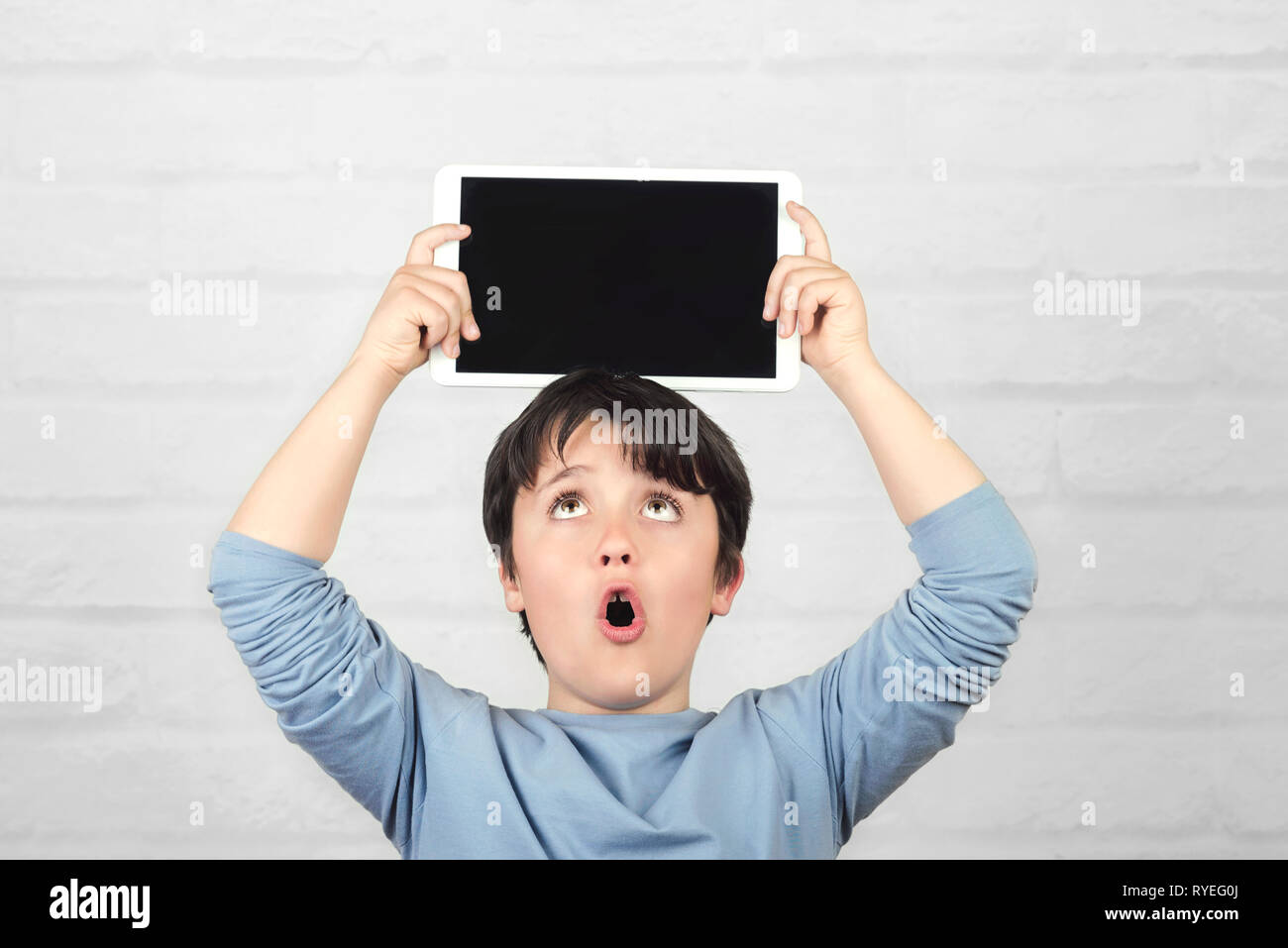 Tablet child holding screen hi-res stock photography and images - Alamy