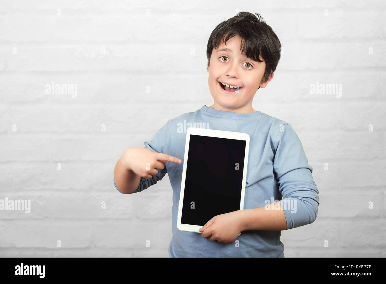 Tablet child holding screen hi-res stock photography and images - Alamy