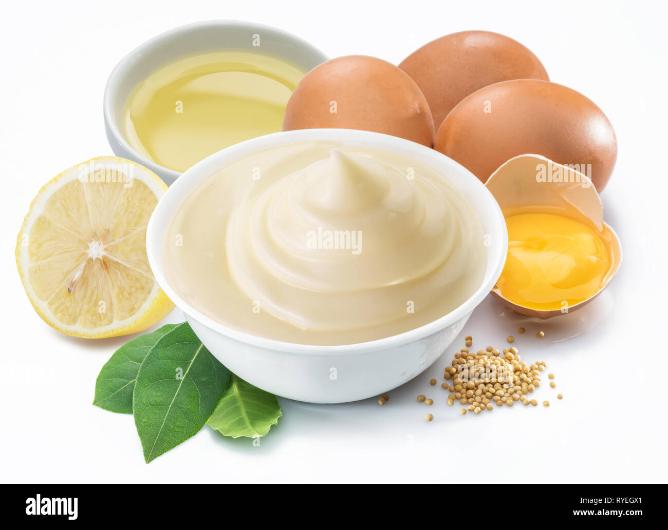Mayonnaise sauce in white bowl with mayonnaise ingredients on white ...