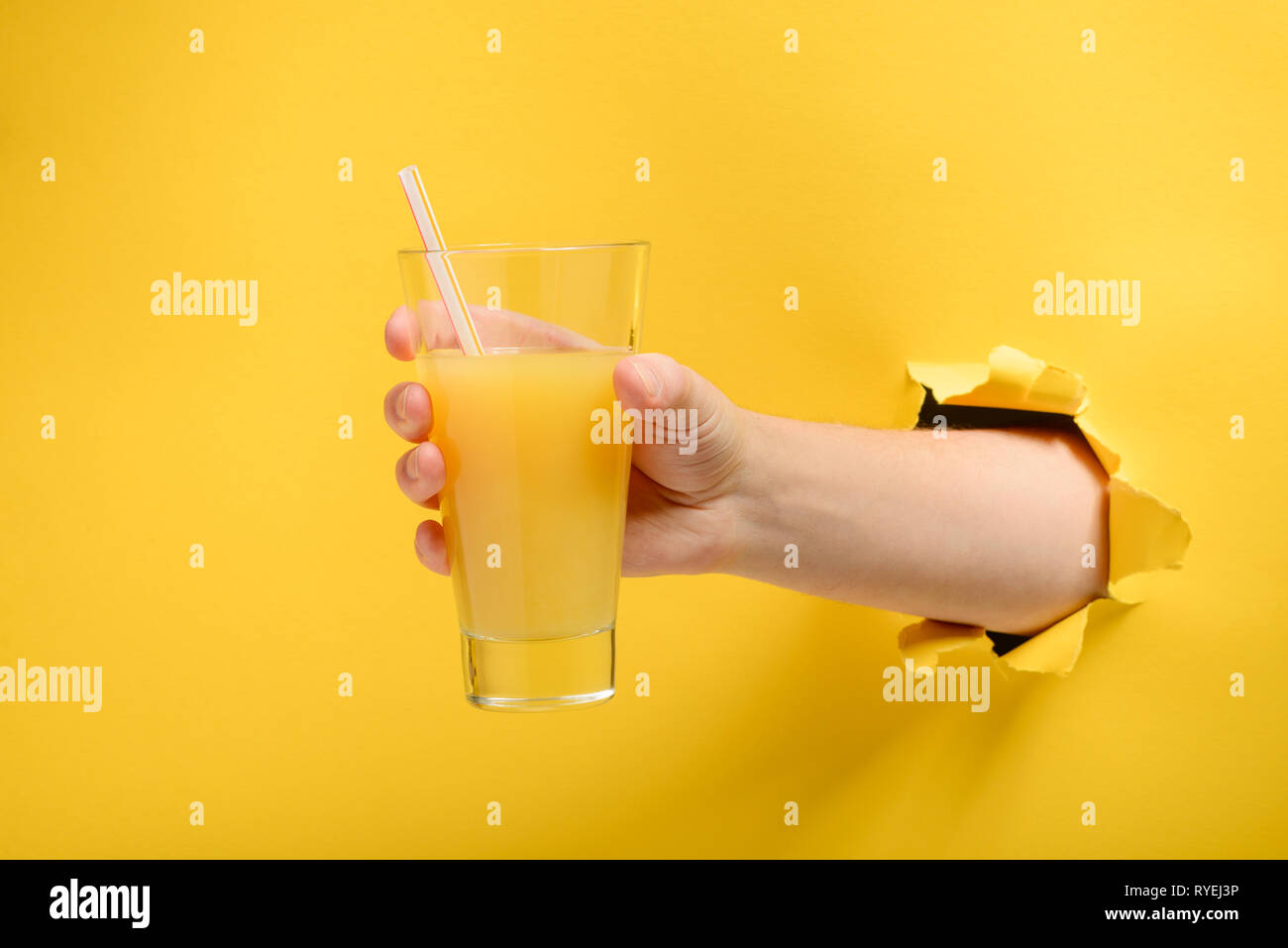 Hand holding a glass Stock Photo - Alamy