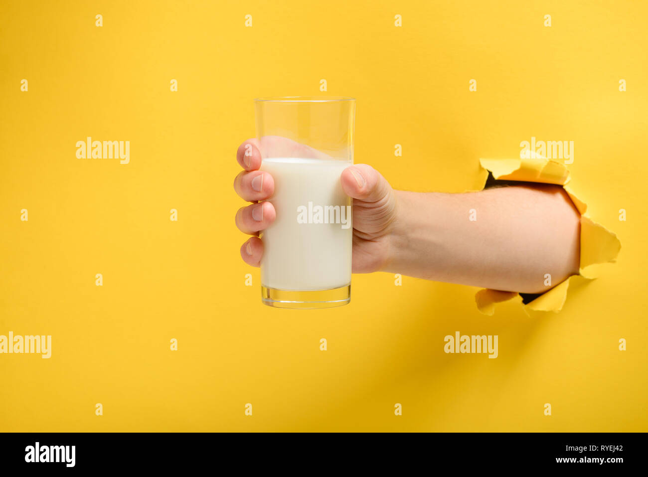Hand taking a glass Stock Photo - Alamy