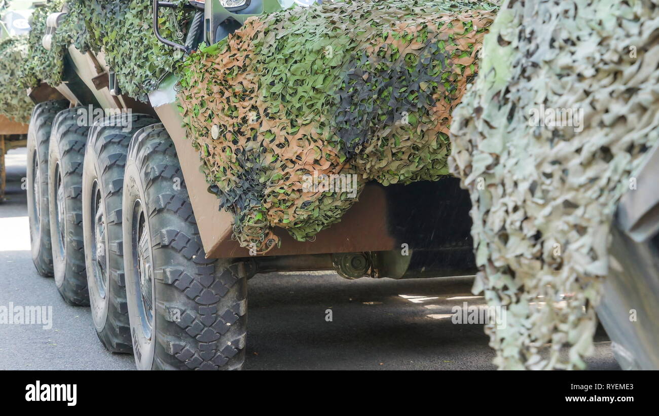 Closer look of the military tank with the camouflage cover on it to be ...