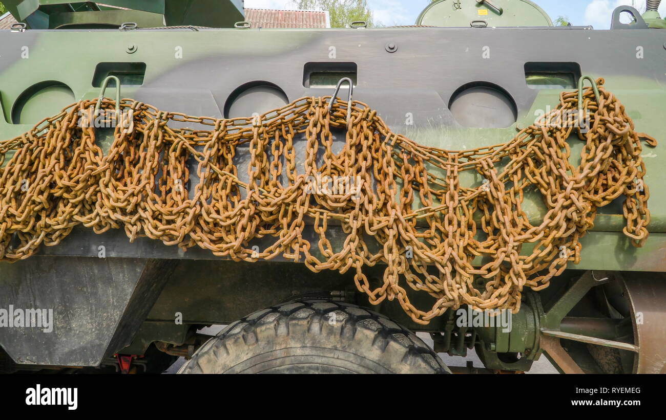 The rusty chains hanging on the military tank used for military ...