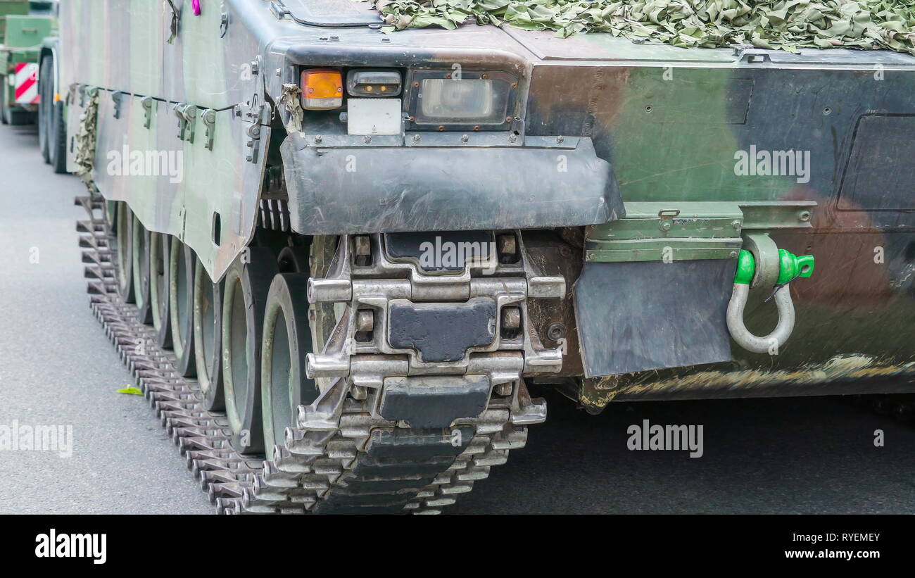 View of the front part of the military tank on the streets in the city ...