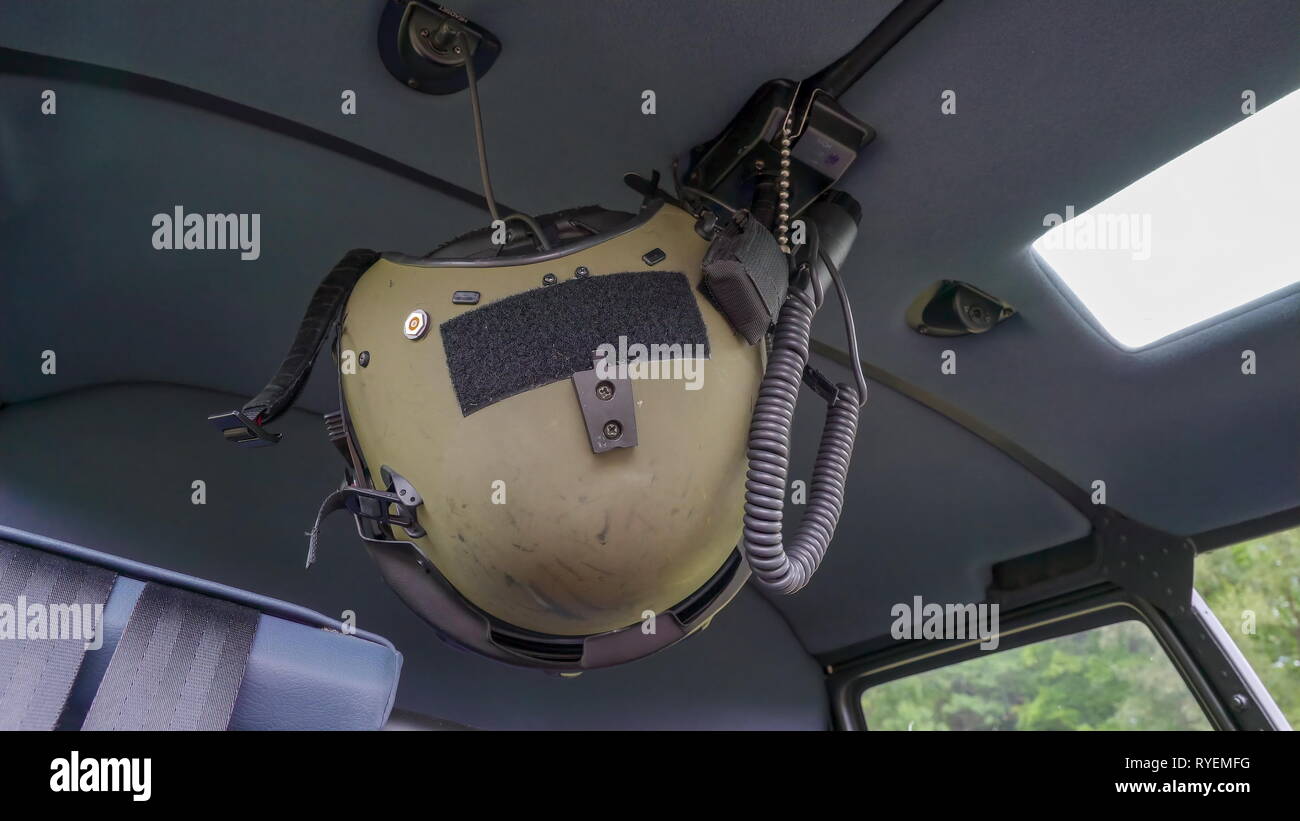 The helmet hanging on the ceiling of the helicopter of the military ...