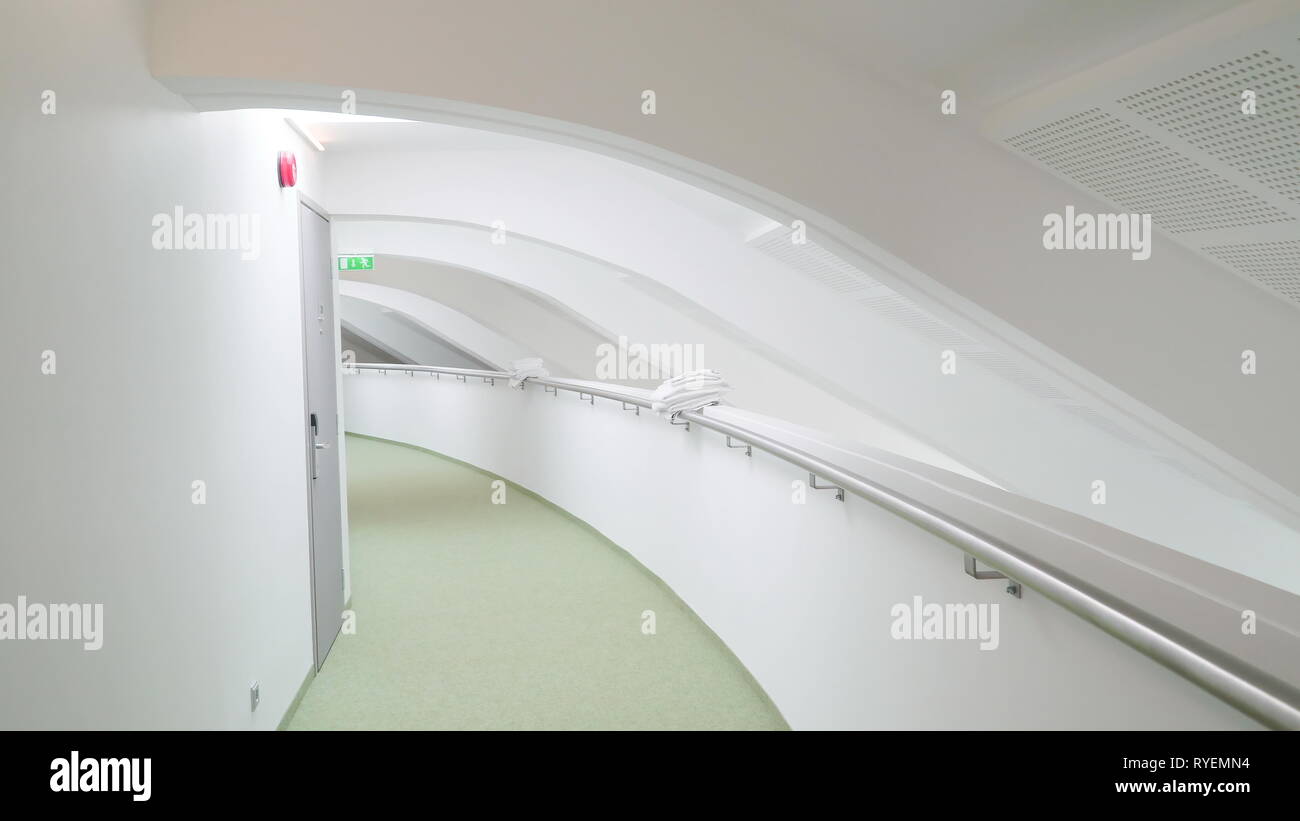 The white wall and the side walk of the hotel with the piles of white ...