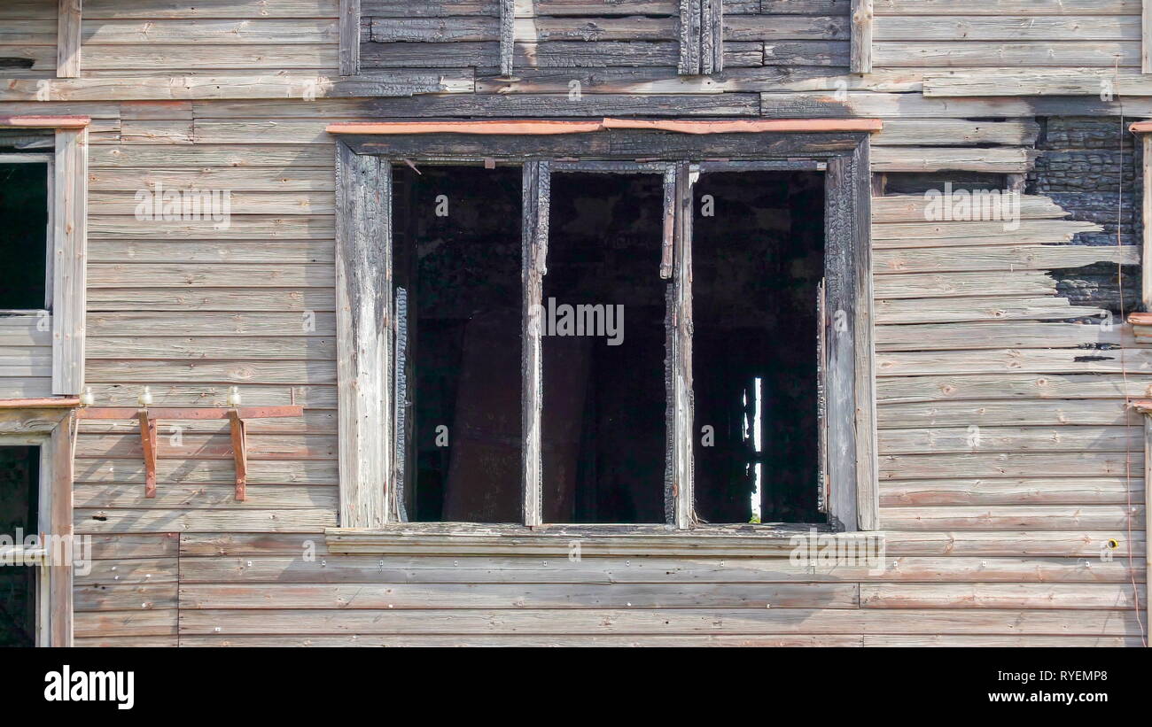 A closer look of the empty window of the house from the fire that left ...