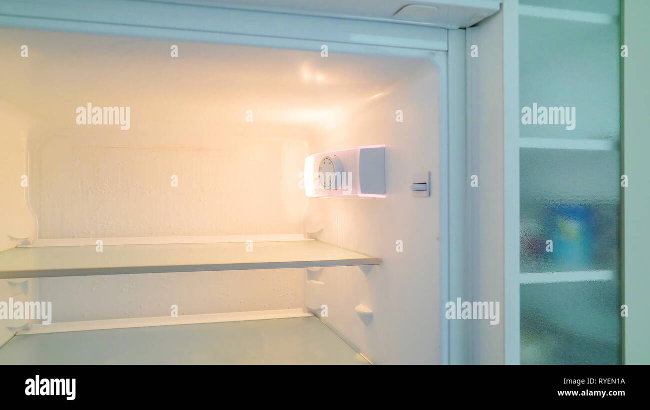 The number knob inside the refrigerator in the kitchen with the emtpy ...