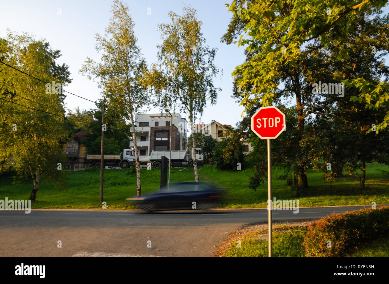 Car at stop sign hi-res stock photography and images - Alamy