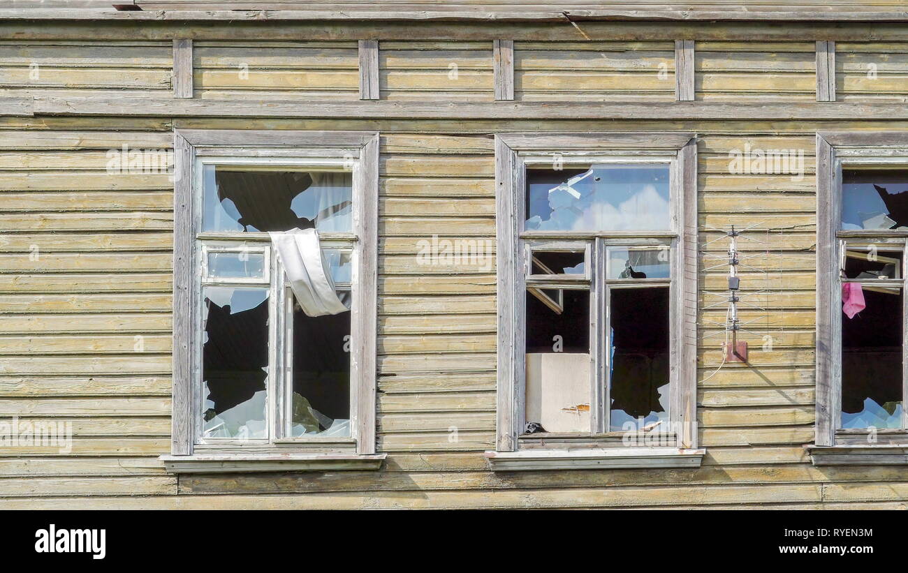 Three broken glass window of the big house that is also has ruined ...