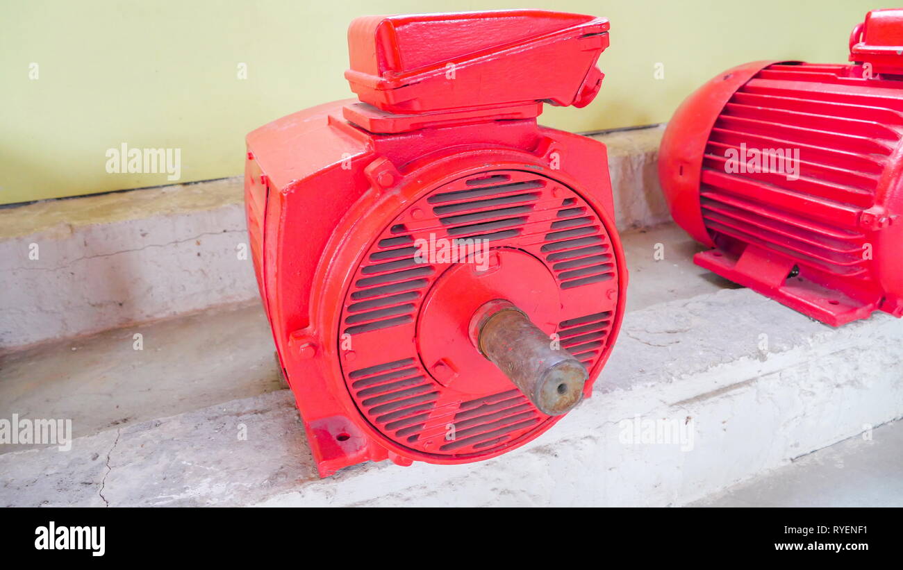Three red hydropower machine on the side wall of the building Stock ...