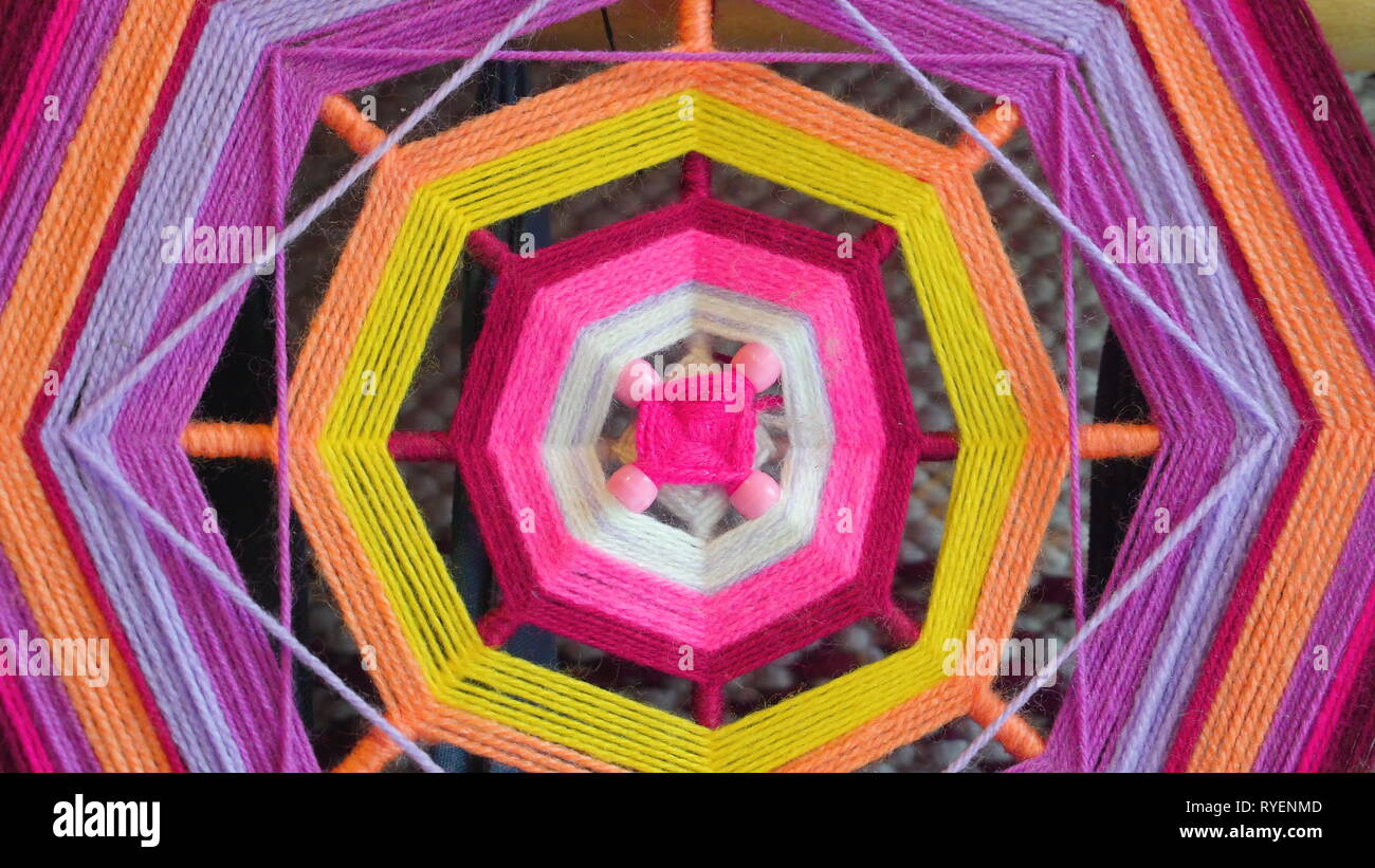 A colorful knitted web using the yarns with different colors using ...