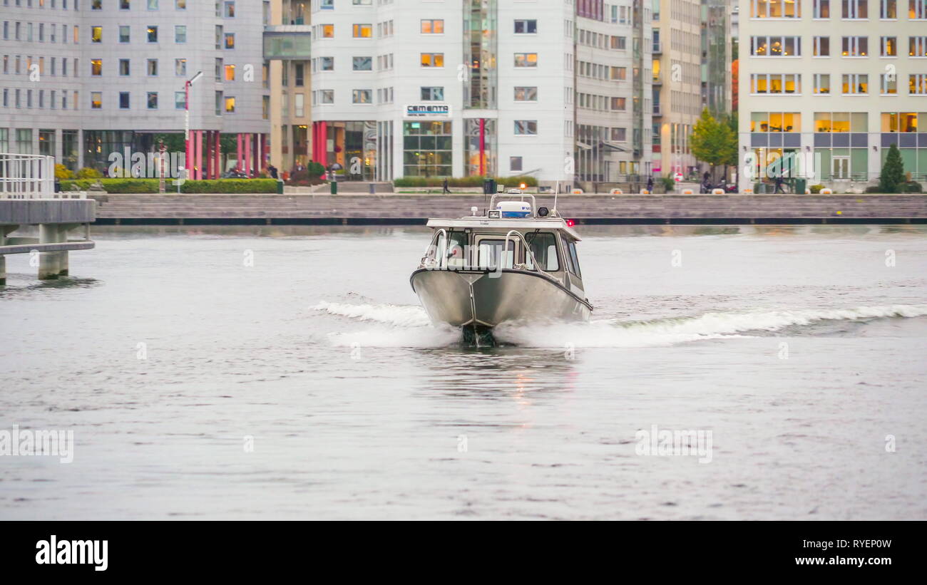A speed boat cruising on the sea in Stockholm in Sweden with few ...