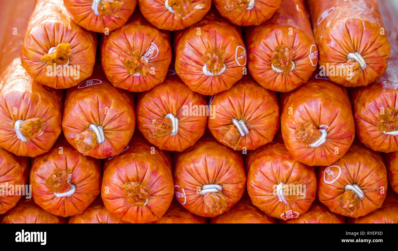 Closer look of the bottom part of the sausage with the red color as ...