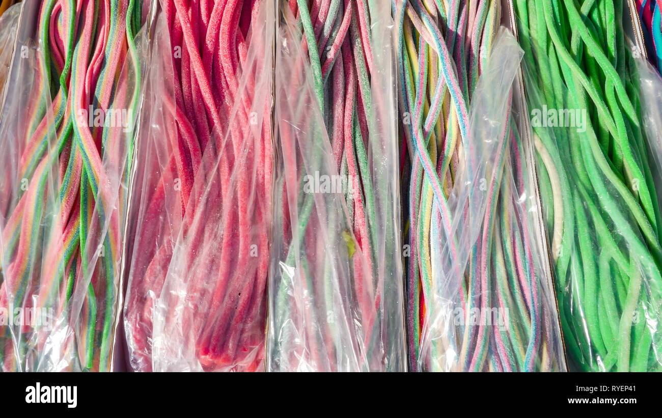 Color sugar candy strips inside the plastic being sold on the bazaar ...