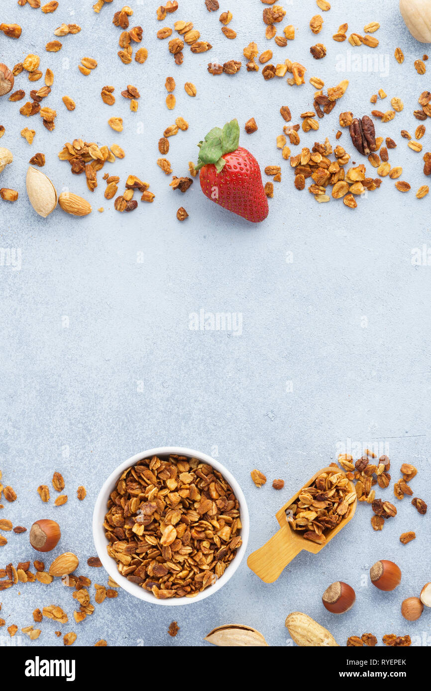 Granola, strawberries and ingredients - oats, various nuts and honey ...
