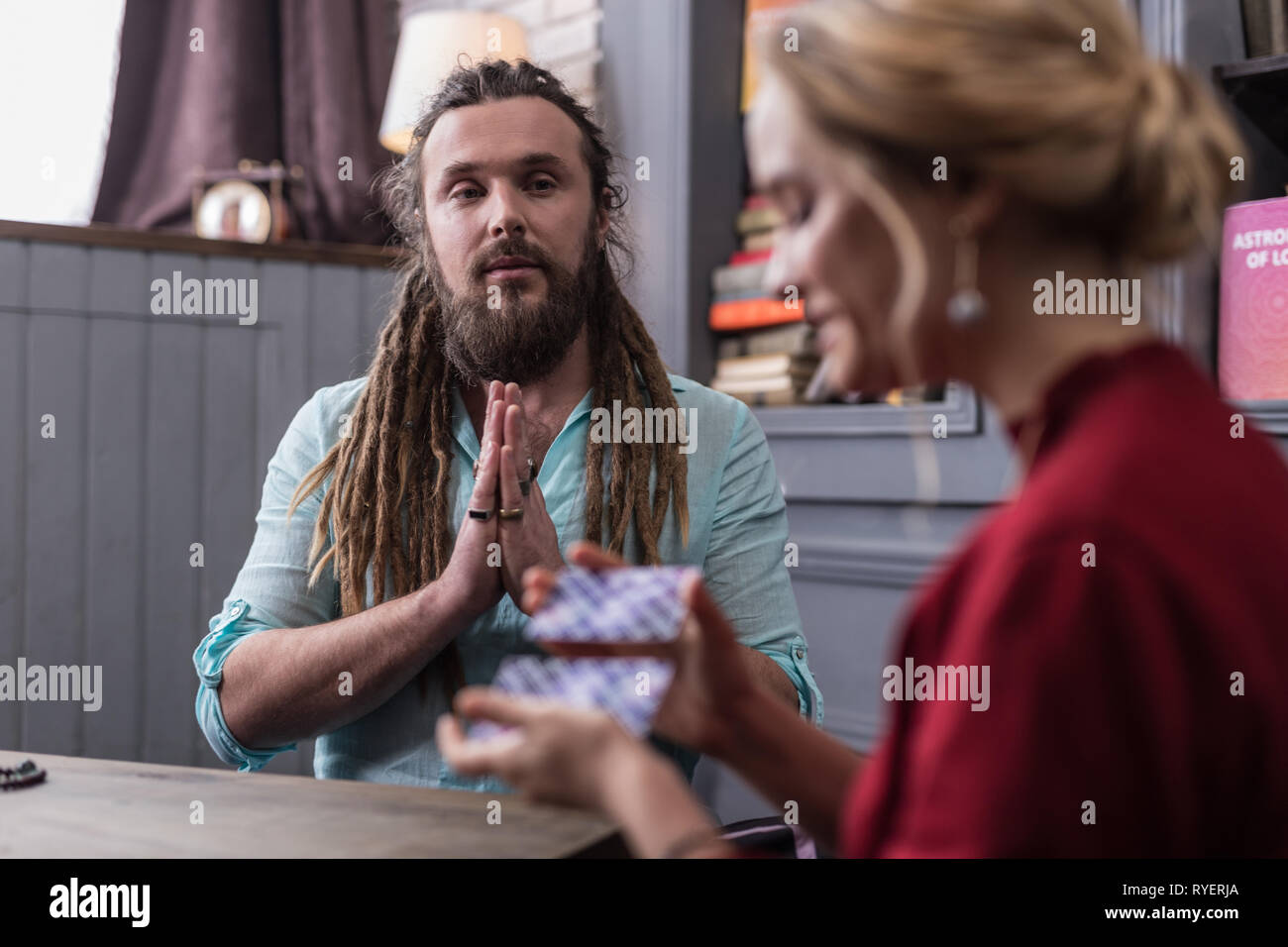Nice good looking man putting his hands together Stock Photo - Alamy