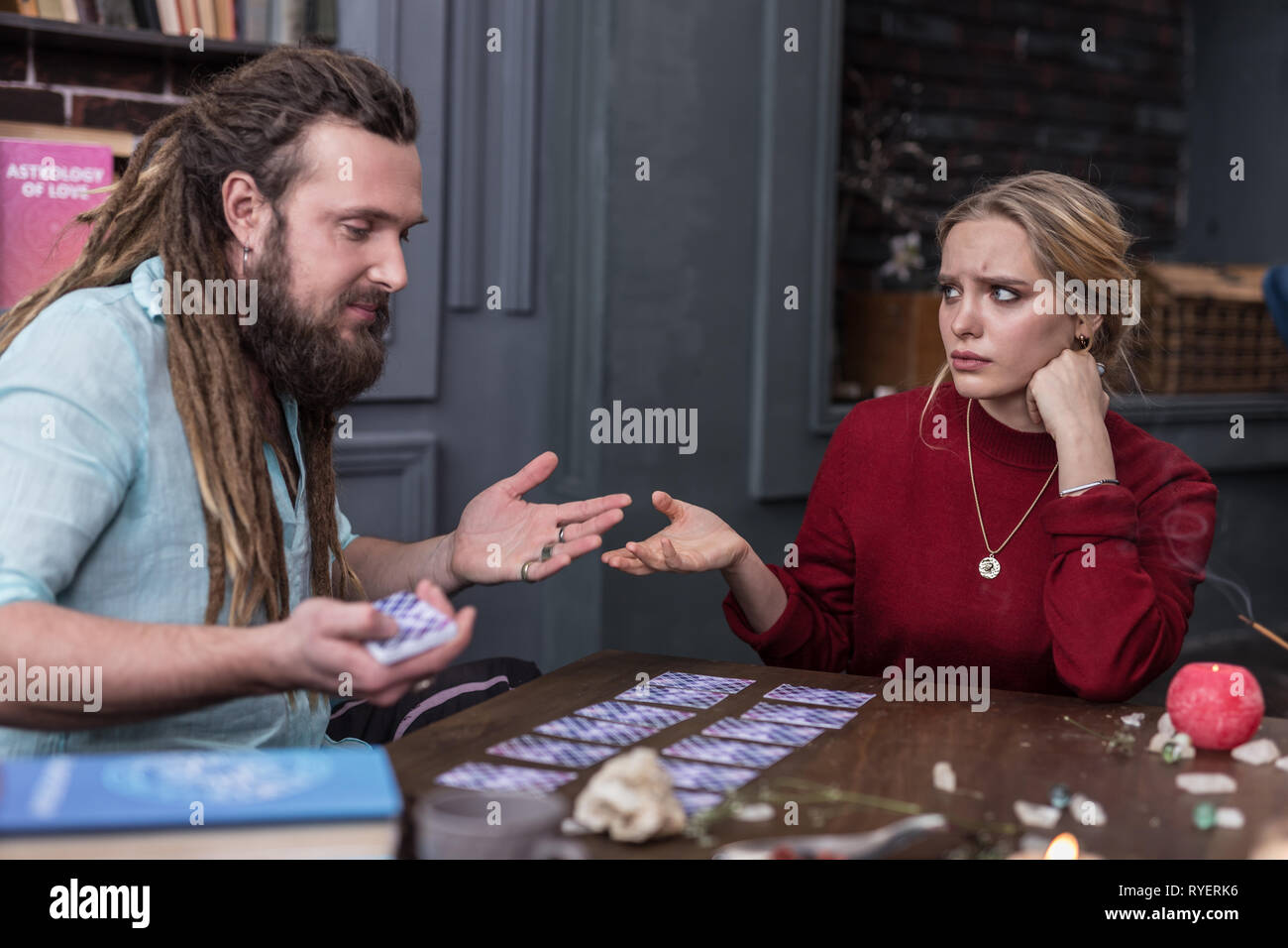 Nice serious woman asking questions about her future Stock Photo - Alamy