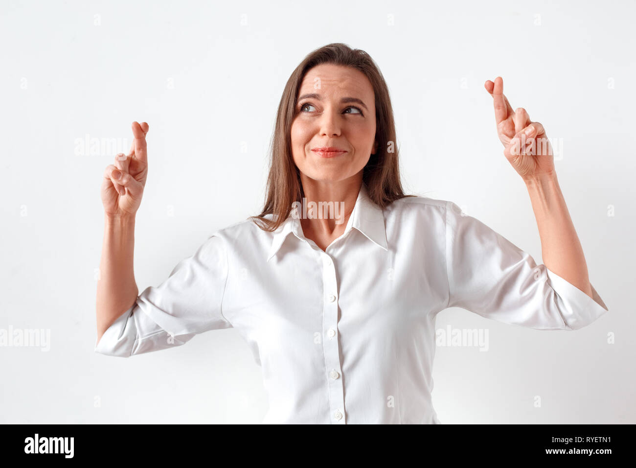 Stylish woman praying crossed fingers hi-res stock photography and ...