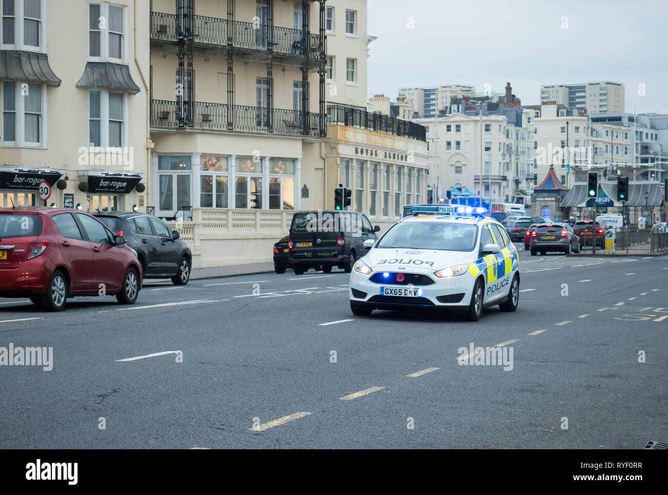 Police car responding to emergency call on King's Road, Brighton in ...