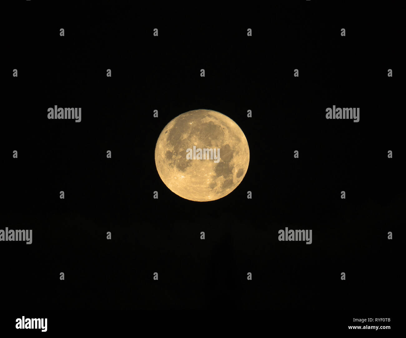Full Moon named Cold Moon rising on black background Stock Photo - Alamy