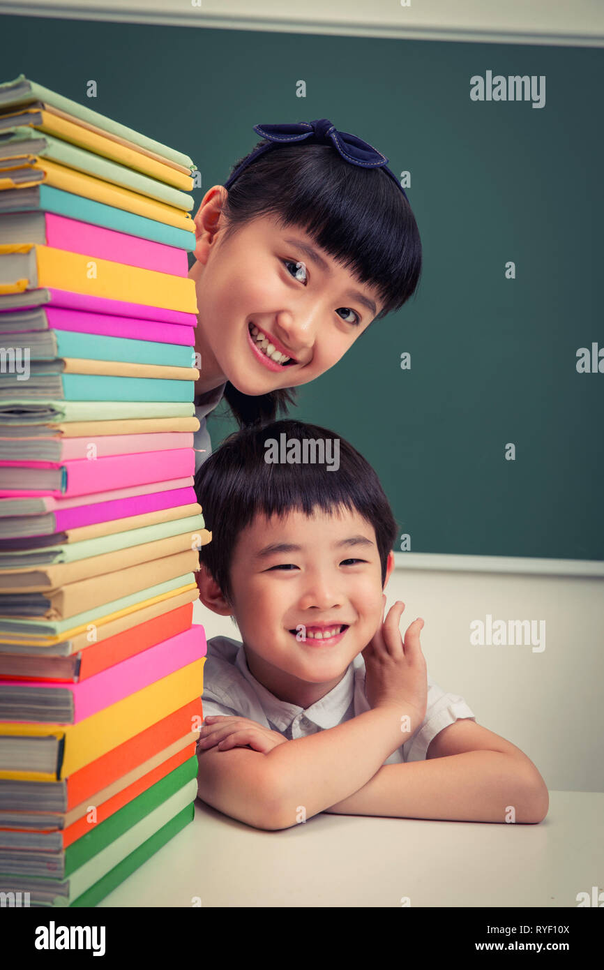 Primary school students and textbooks Stock Photo - Alamy