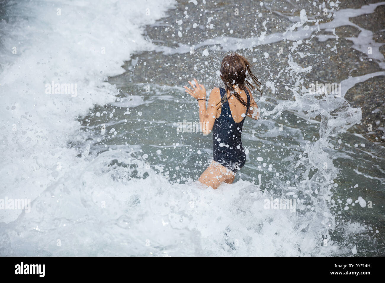 Jumping into the waves hi-res stock photography and images - Alamy