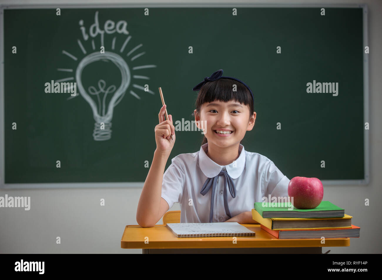 Primary school girls in the classroom Stock Photo - Alamy