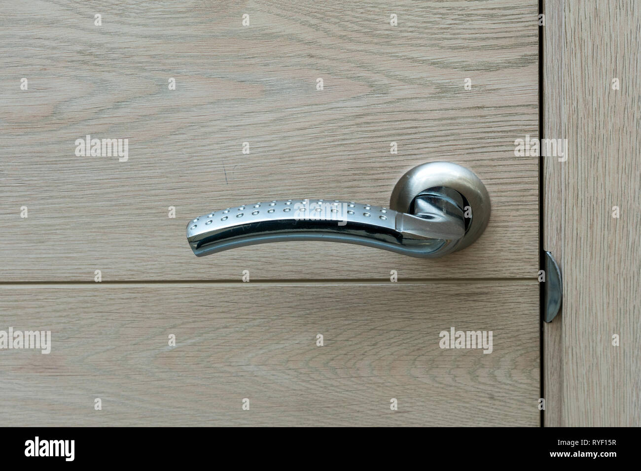 Closeup of metal doorhandle Stock Photo - Alamy