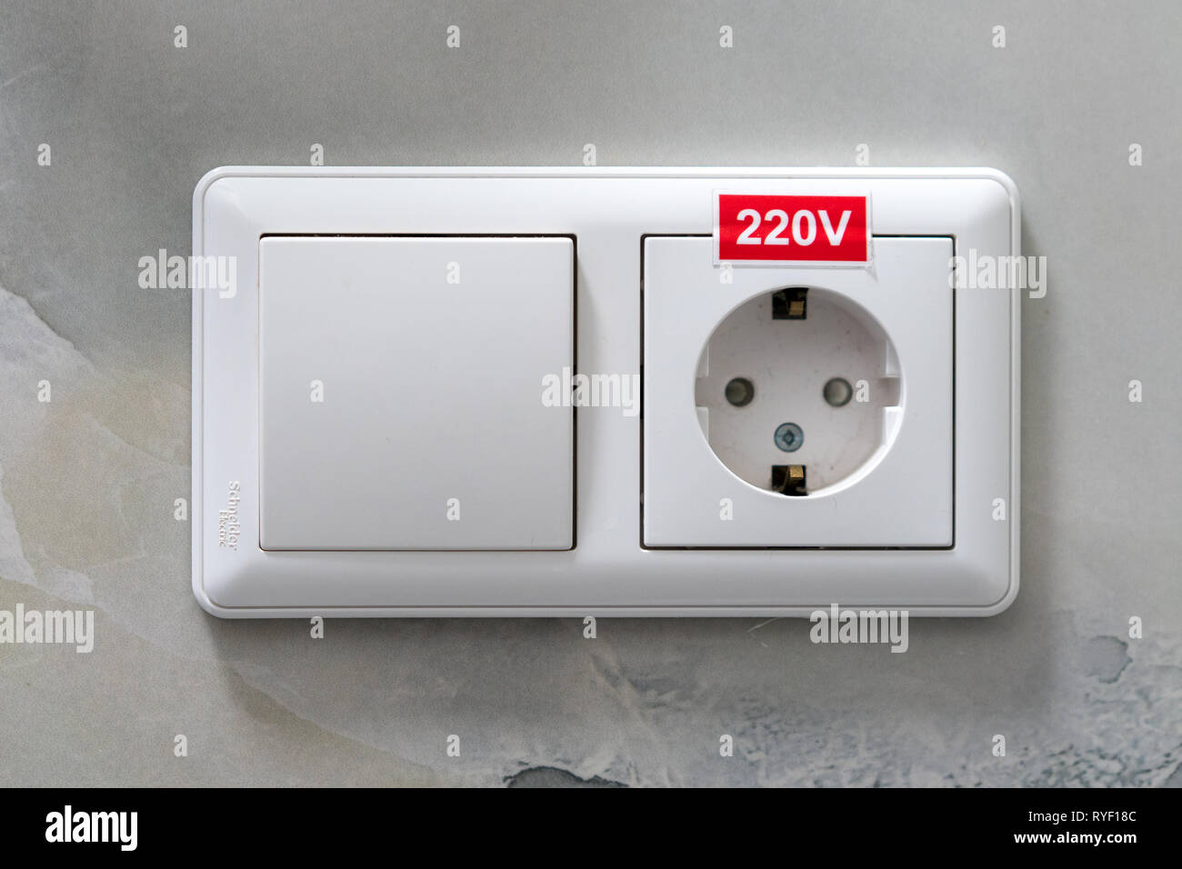 electric socket and a switch on the wall of the hotel Stock Photo - Alamy