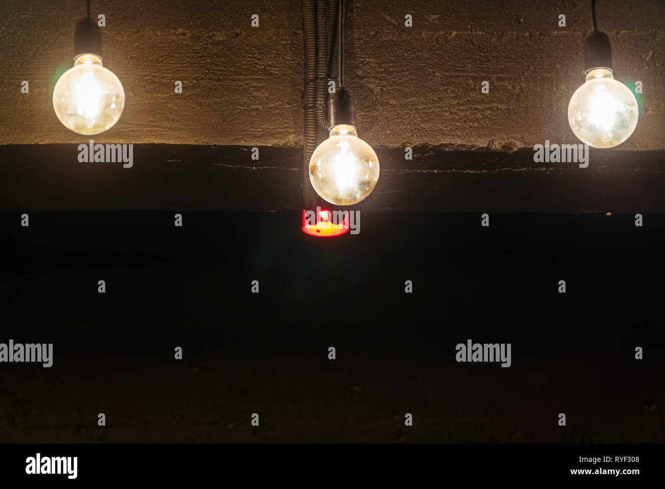 Light bulbs against the dark ceiling Stock Photo - Alamy