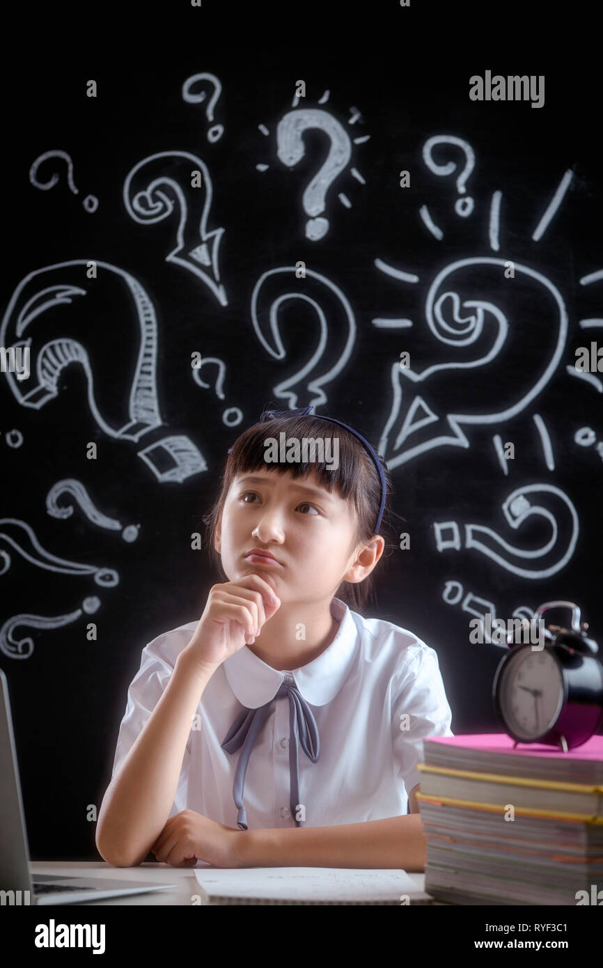 Indian school girl student thinking hi-res stock photography and images ...