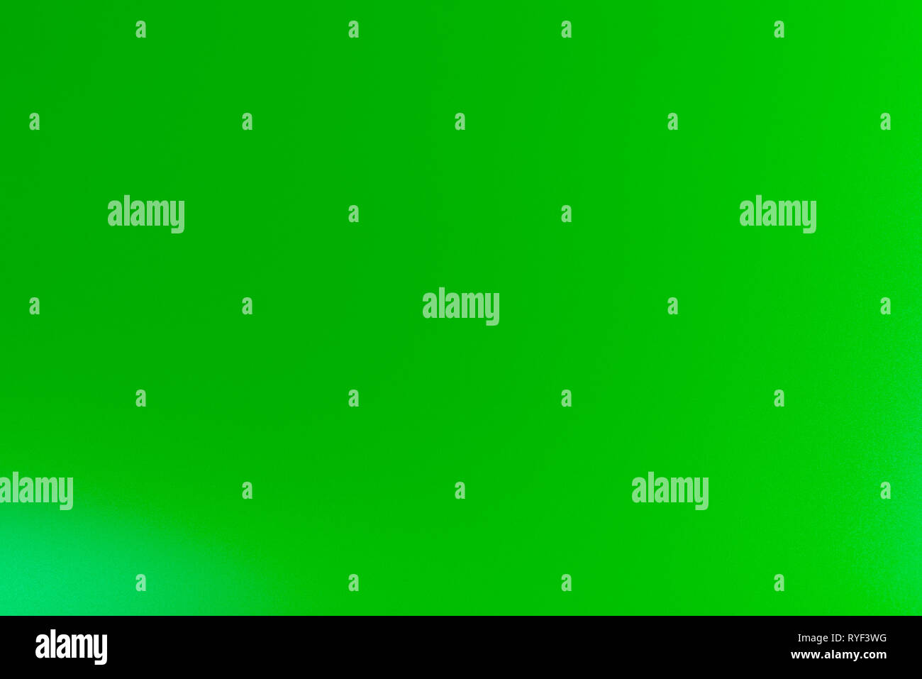 Texture in a bright, green color illuminated with a delicate light ...