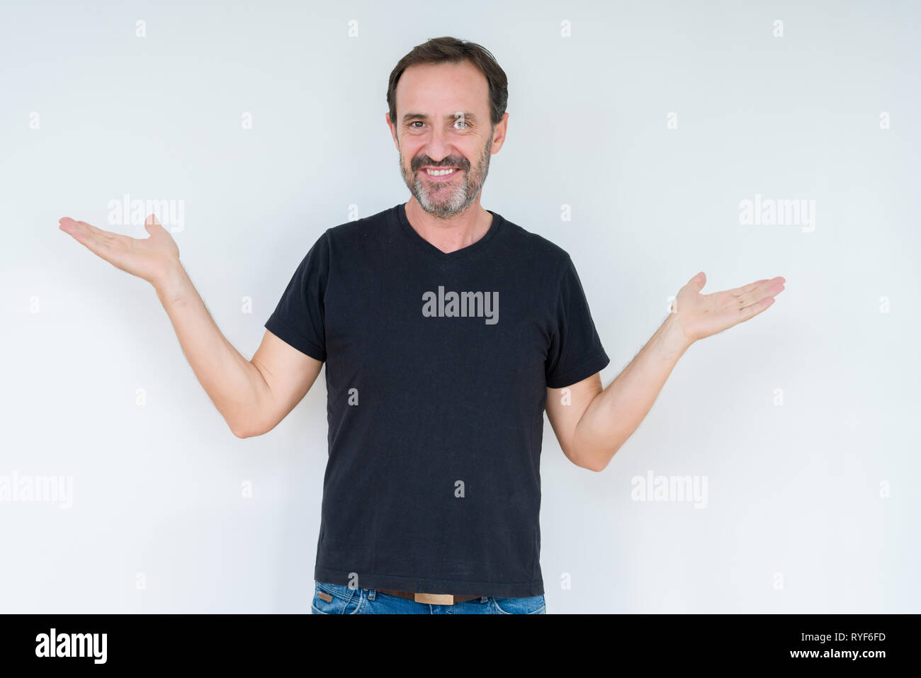 Senior man over isolated background Smiling showing both hands open ...