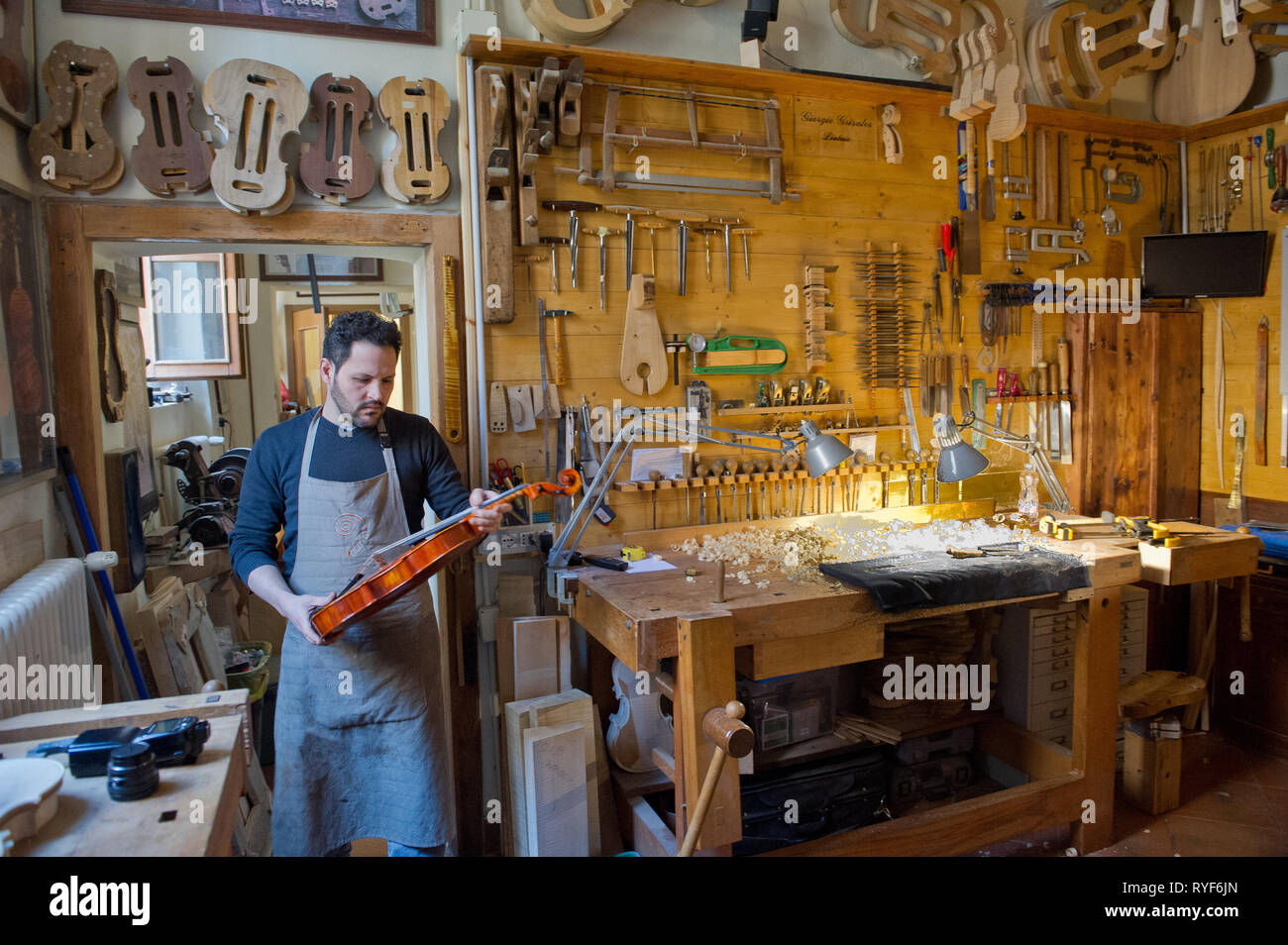 Europe, Italy, Lombardy, Cremona, workshop of artisan luthier. Master ...