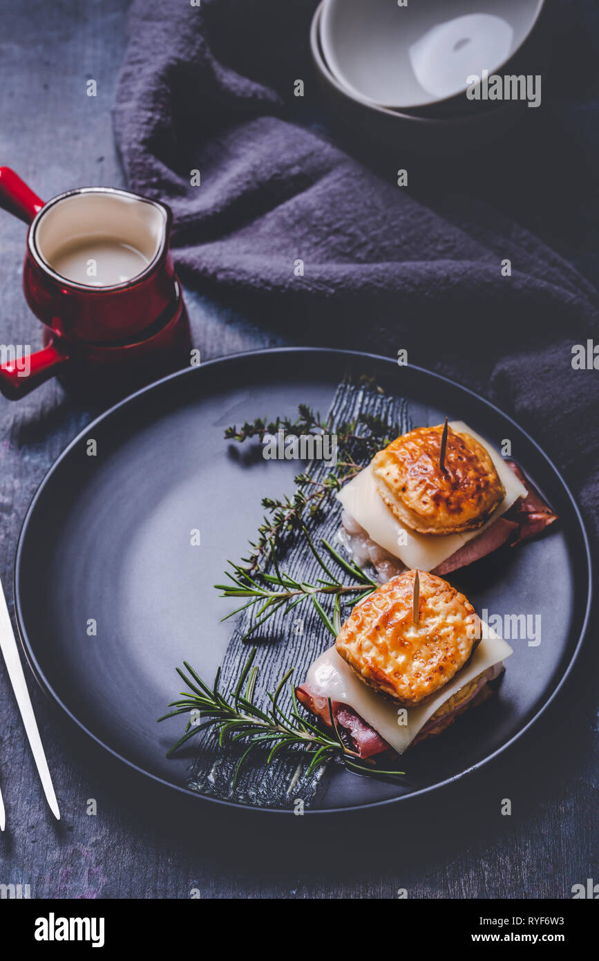 Vertical photo with two sandwiches. Sandwiches are from puff pastry ...
