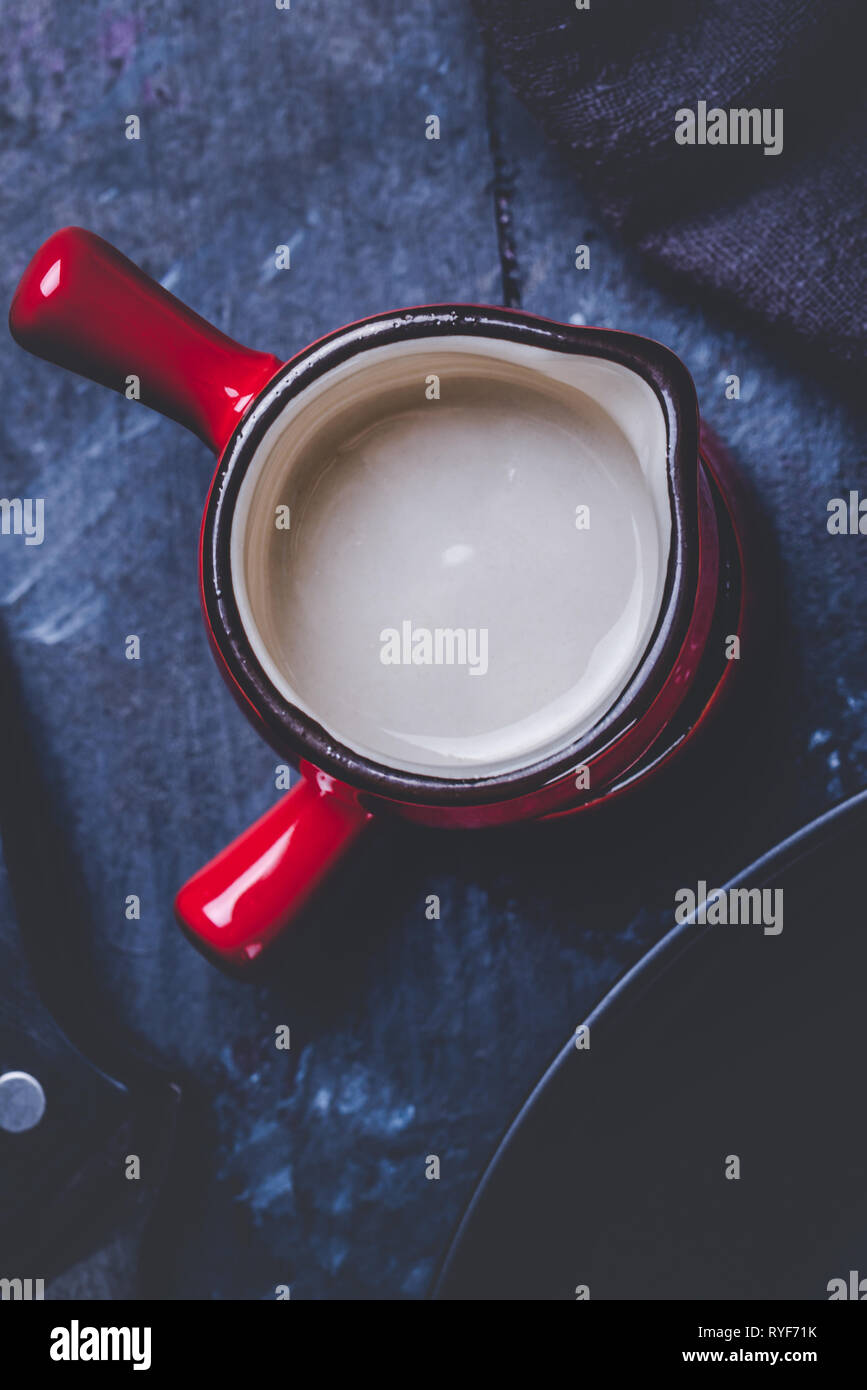 Vertical photo with top view on two cups. Cups or small bowls have ...