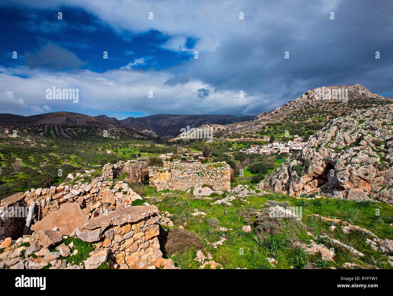 Abandoned houses in Pezoulas hamlet. In the background Ano Pervolakia ...