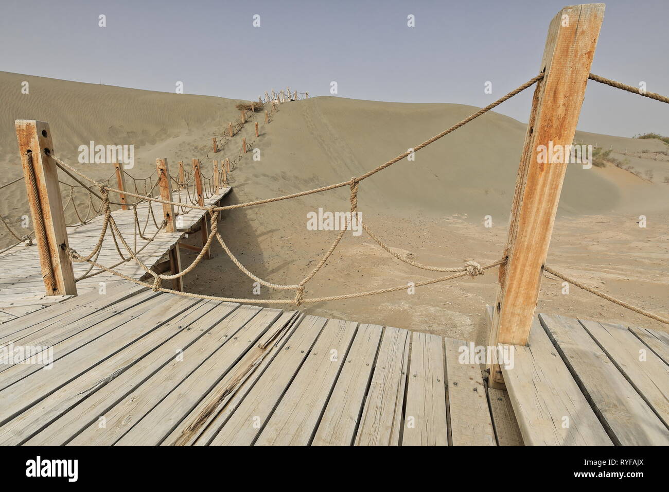 Wooden boardwalks-walkways for visiting the Rawak Stupa. Taklamakan ...