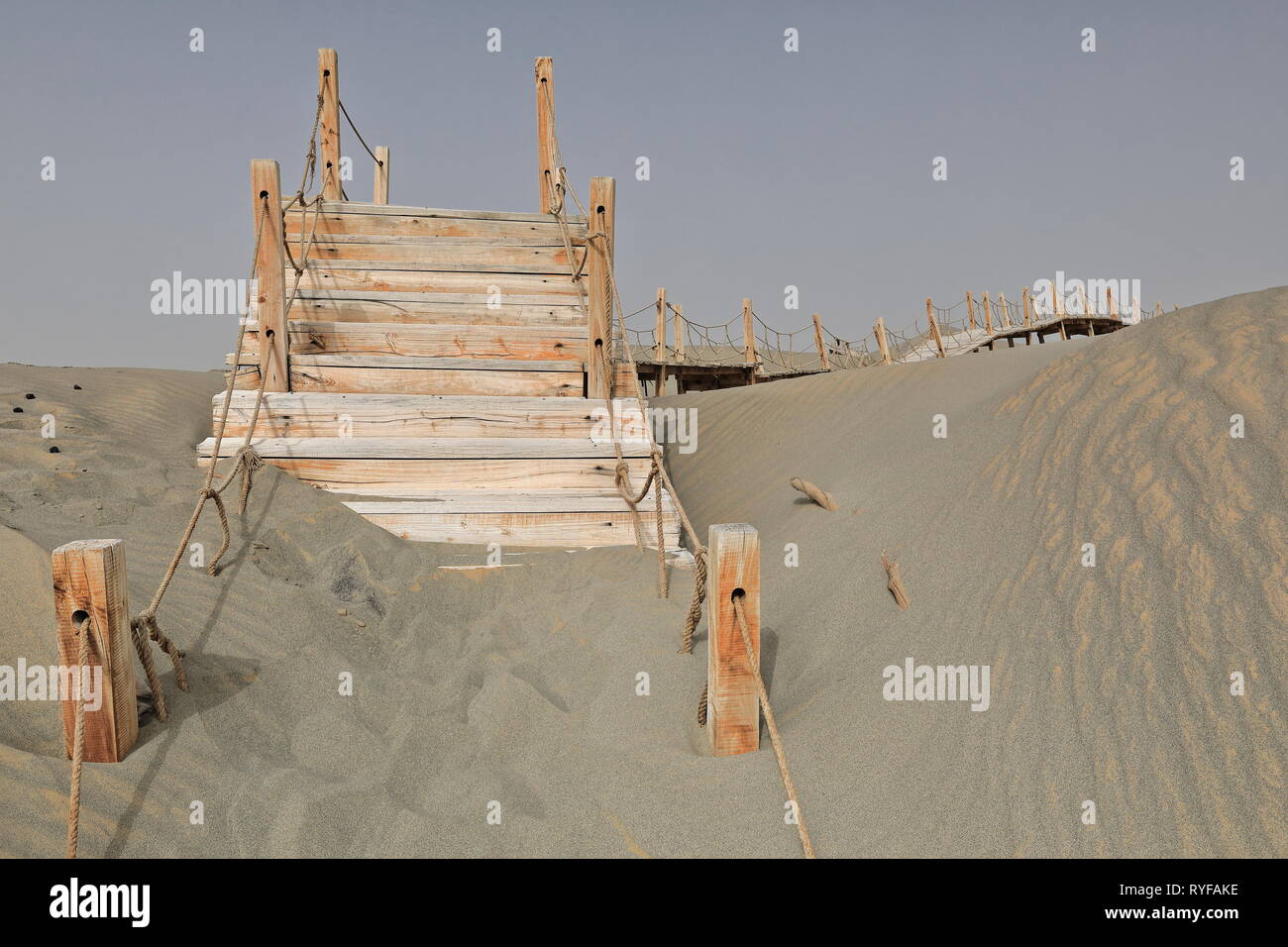 Wooden boardwalks-walkways for visiting the Rawak Stupa. Taklamakan ...