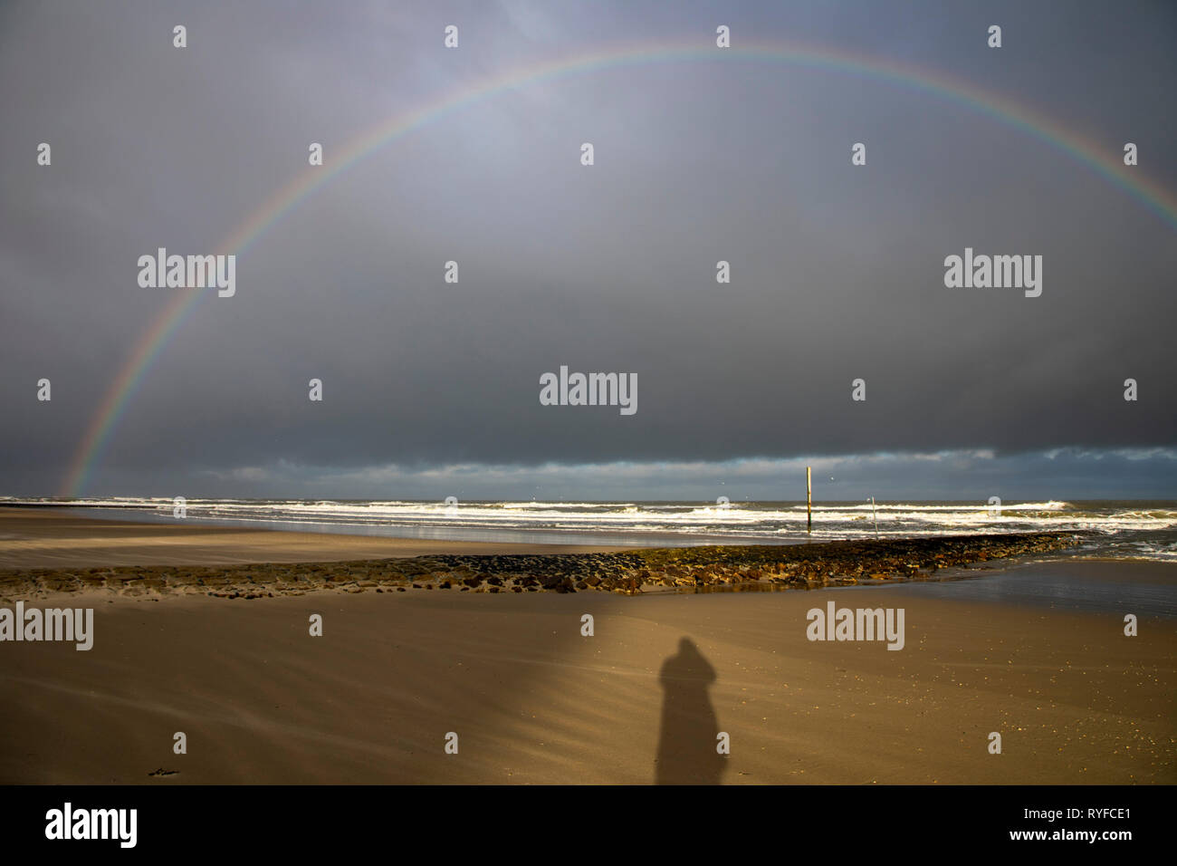 Island Wangerooge, Ostfriesland, rainbow at over the beach, during a ...