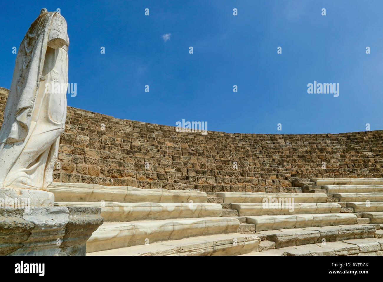 Ancient statue and seats at Roman amphitheatre in Salamis. Northern ...