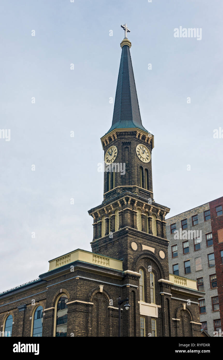 landmark church facade with bell tower and steeple in downtown ...