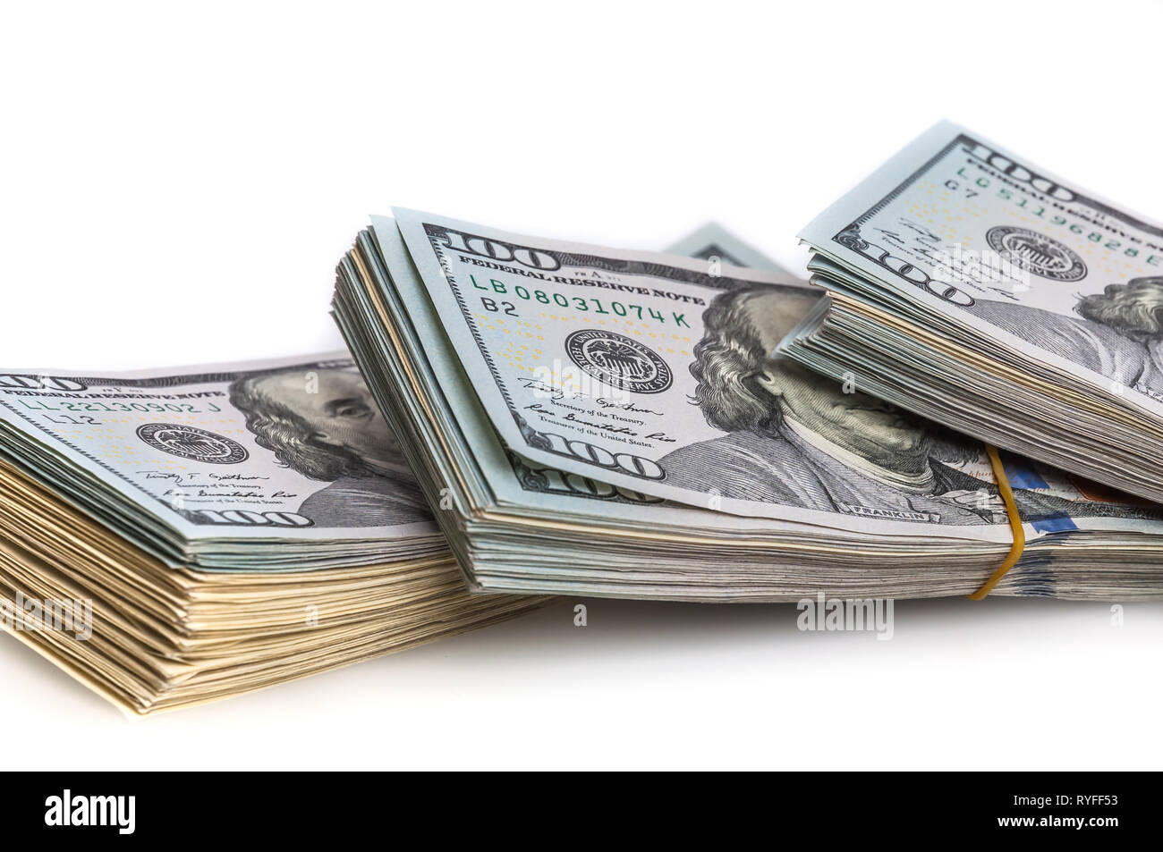 Banknotes of dollars in packs. Isolated white background Stock Photo ...