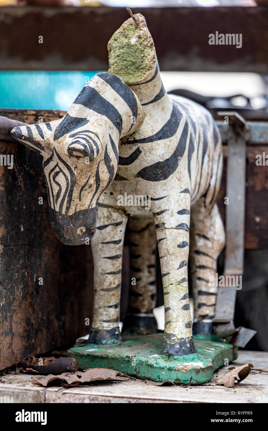 The damaged statue of zebra with a falling head, close up Stock Photo ...