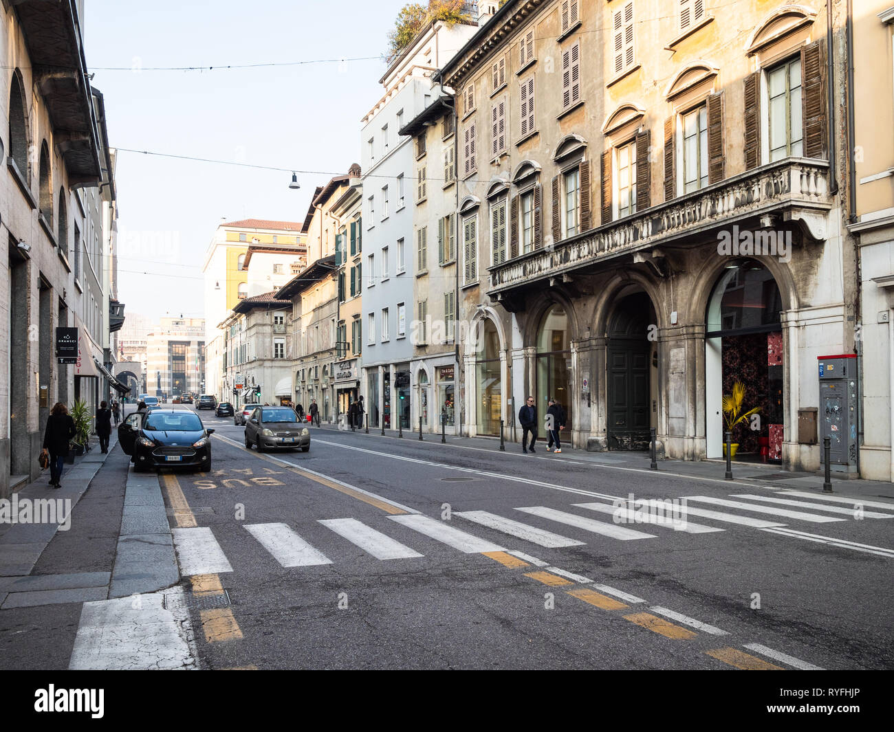 BRESCIA, ITALY - FEBRUARY 21, 2019: people and cars on street Via ...