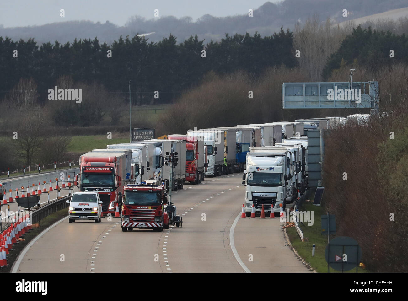 Lorries queue on the A20 outside Dover in Kent where Operation Stack is ...