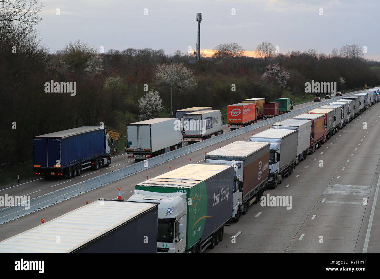Lorries queue on the A20 outside Dover in Kent where Operation Stack is ...