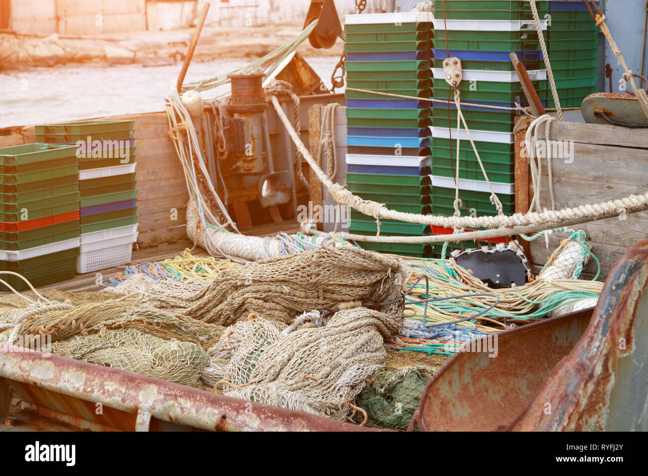 Trawl, pelagic boards, fishing net and boxes for fish lies on the ...